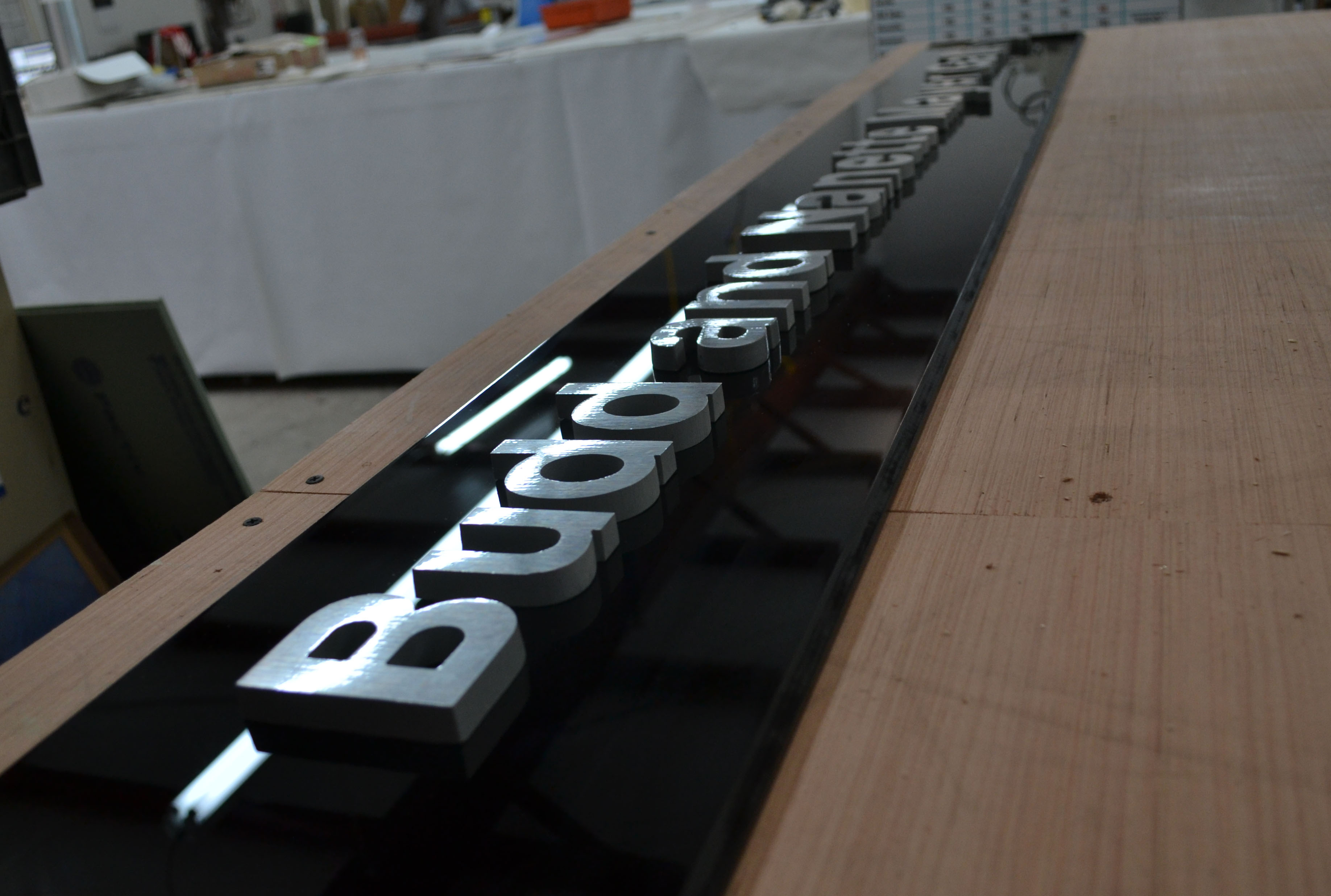 3D Metal Letters on Black Acrylic